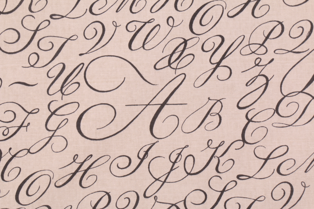Waverly Cursive Caps Printed Cotton Drapery Fabric in Putty